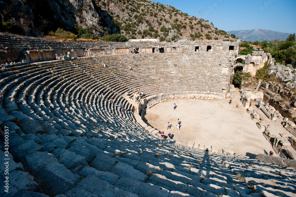 Tourists Visiting Ancient Amphitheater Stock Photo | Adobe Stock