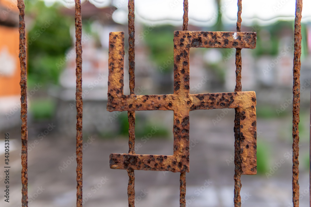 Rusted Hindu Swastika on Fence Stock Photo | Adobe Stock