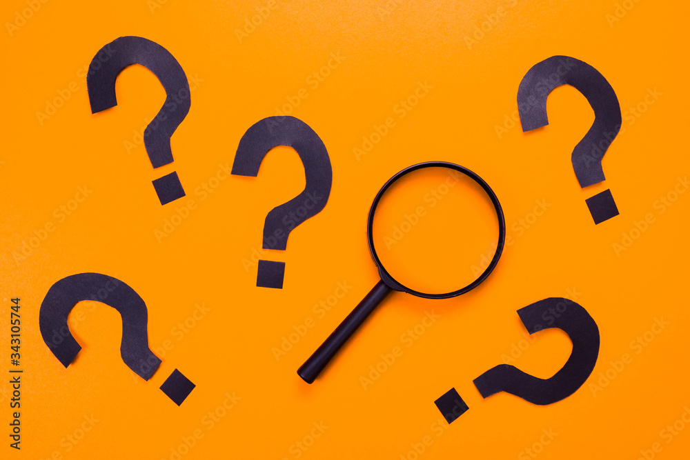 Magnifying Glass and Question Marks Stock Photo | Adobe Stock