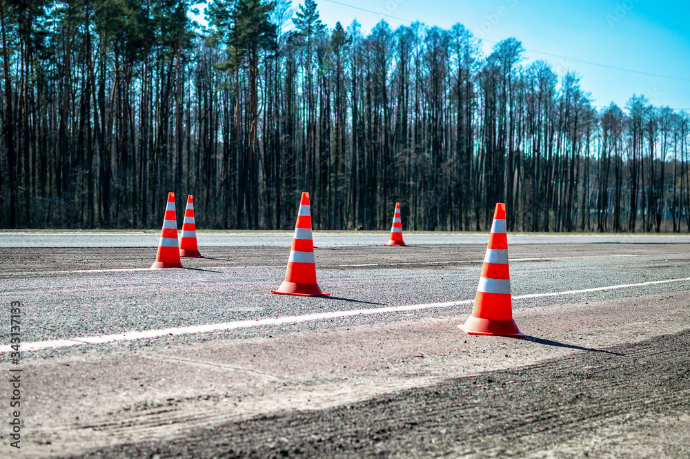Traffic cones are exposed on asphalt on an interurban road. Stock Photo ...