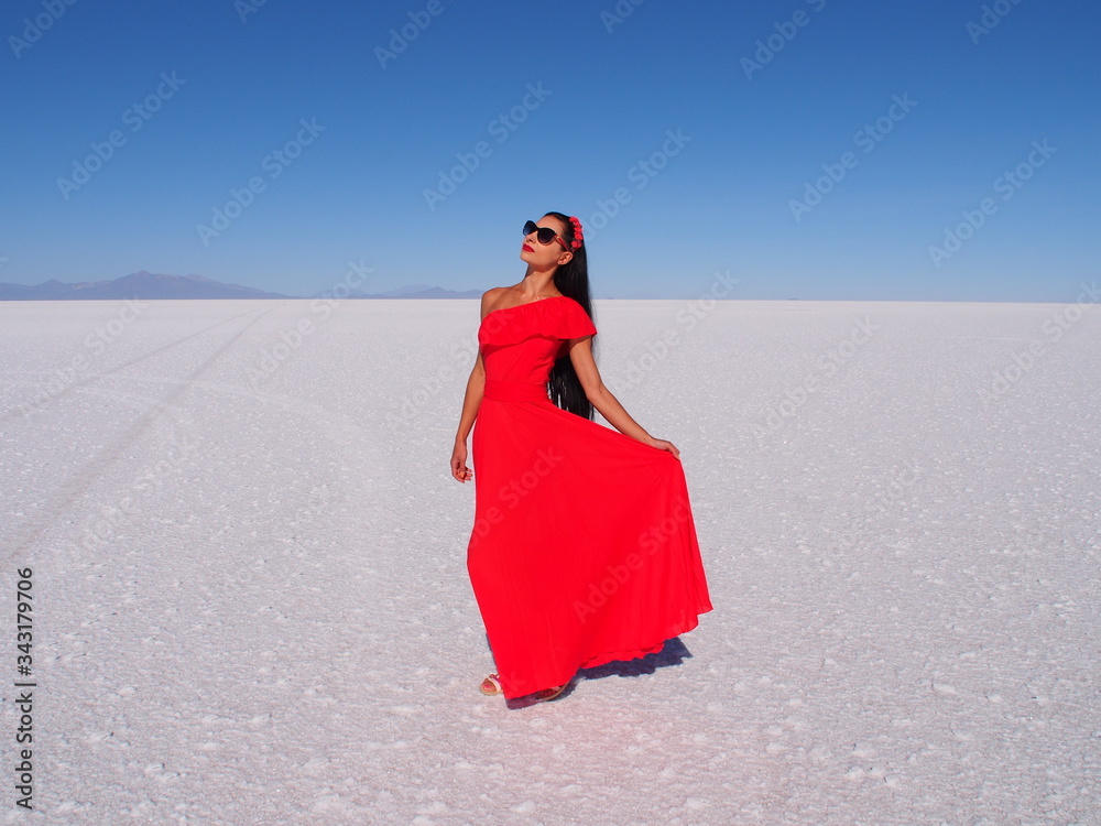 Girl model with long black hair in the red long dress, Uyuni Salt Flat ...