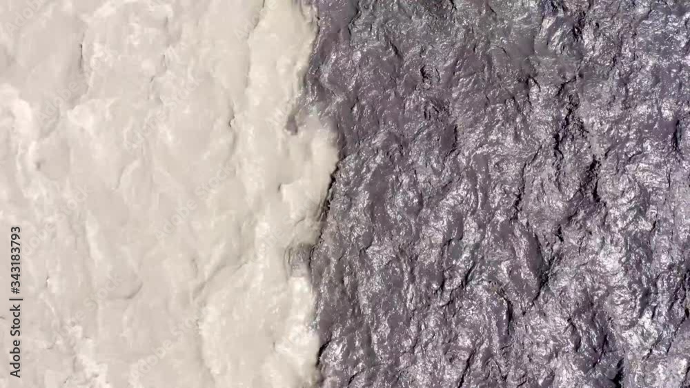 amazing view of the confluence of two rivers with different colors of ...