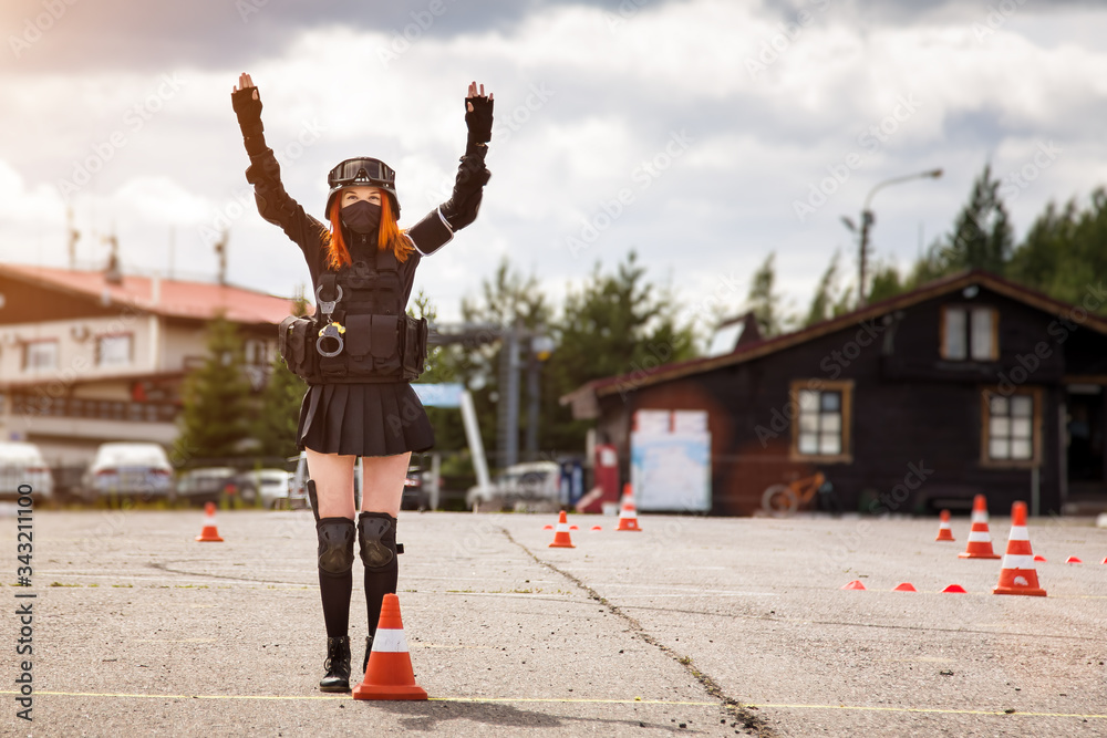 A girl in black military uniform of a special forces detachment ...
