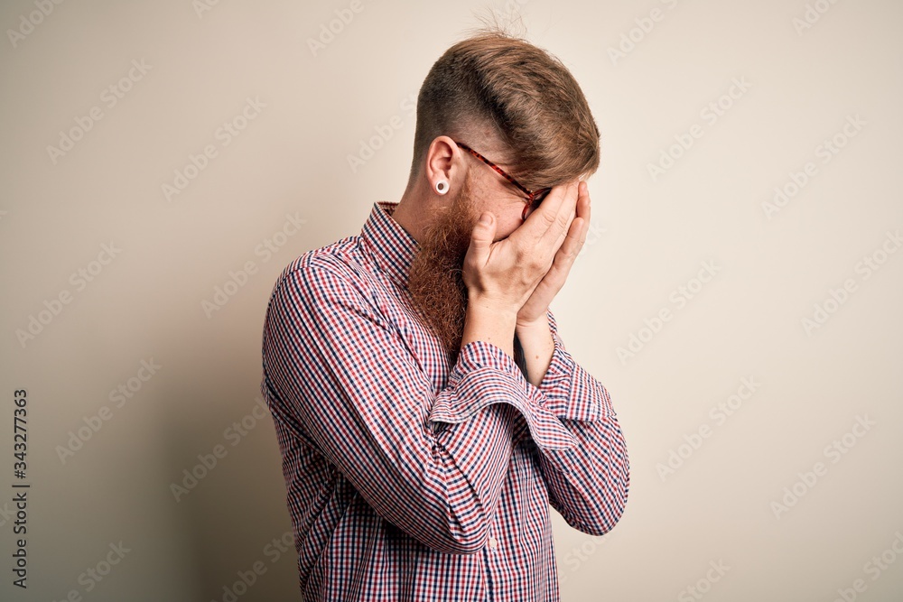 Handsome Irish redhead business man with beard wearing glasses over ...