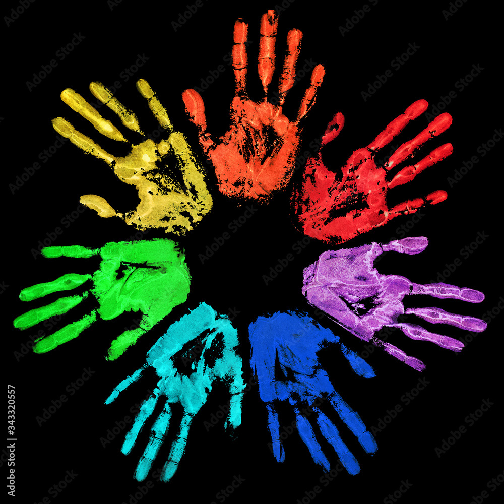 Rainbow color hands print in circle on black background isolated close ...