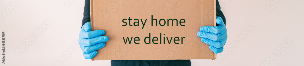 Home delivery with quote STAY HOME WE DELIVER on cardboard box banner ...
