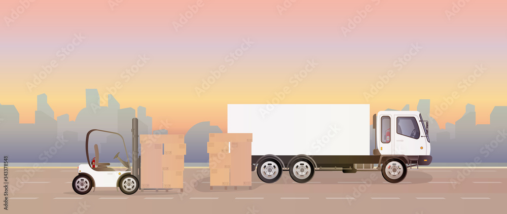 A lorry and a pallet with cardboard boxes stands on the road. Forklift ...