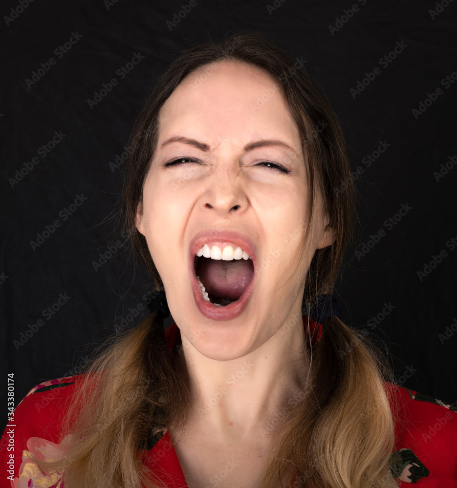 Emotion. Closed woman face with facial expressions over black ...