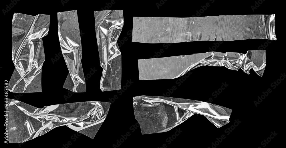 Metallic sticky teared tape shapes isolated on black background. Shiny ...