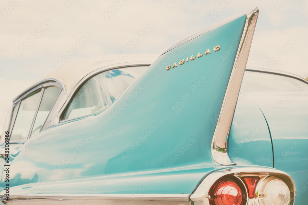 Retro styled rear end of a classic blue Cadillac fifties car in Den ...