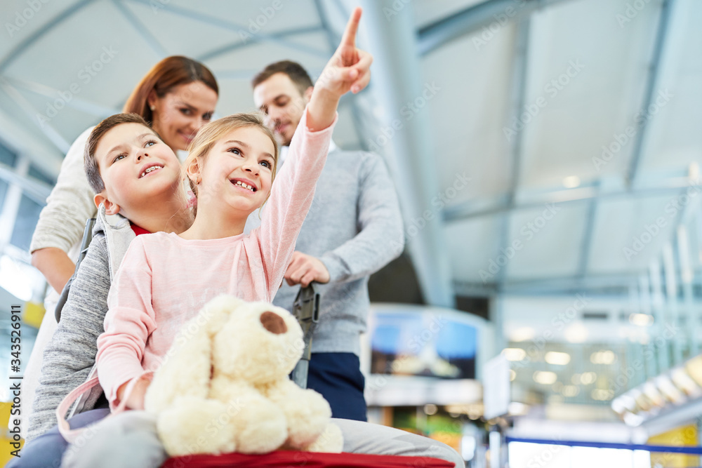 Happy children and parents are flying on vacation Stock Photo | Adobe Stock