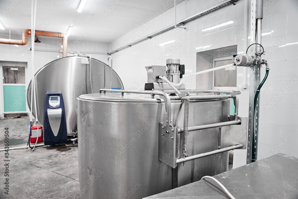 Automated cow farm, milk tanks. Milking machine, modern production ...