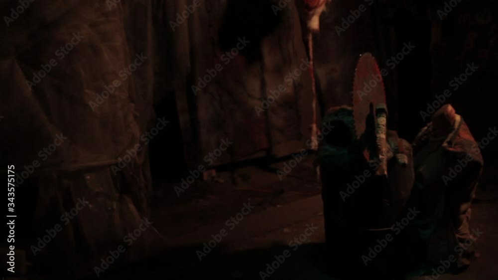 Silhouette of man maniac or killer or horror murderer with chainsaw in ...