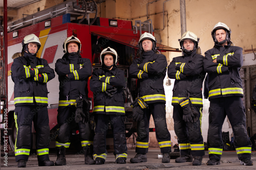 Six professional firefighters posing together. Firefighters wearing ...