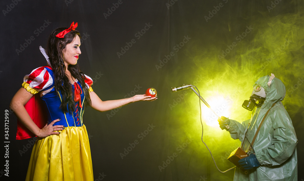 Woman dressed as fairytale character holds Radioactive atomic nuclear ...