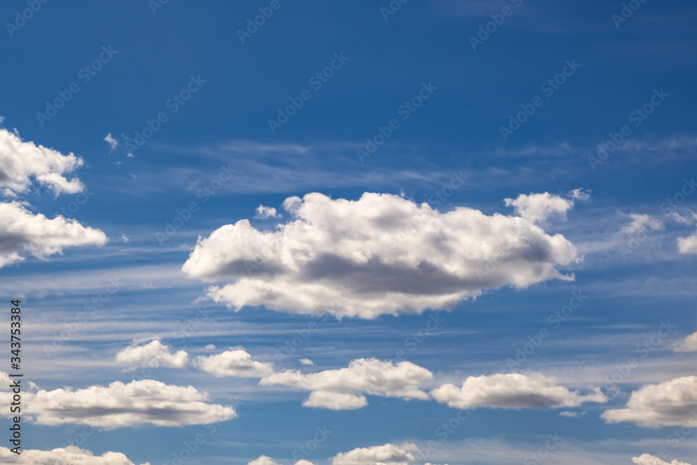 Blue sky background with big tiny stratus cirrus striped cloud before ...