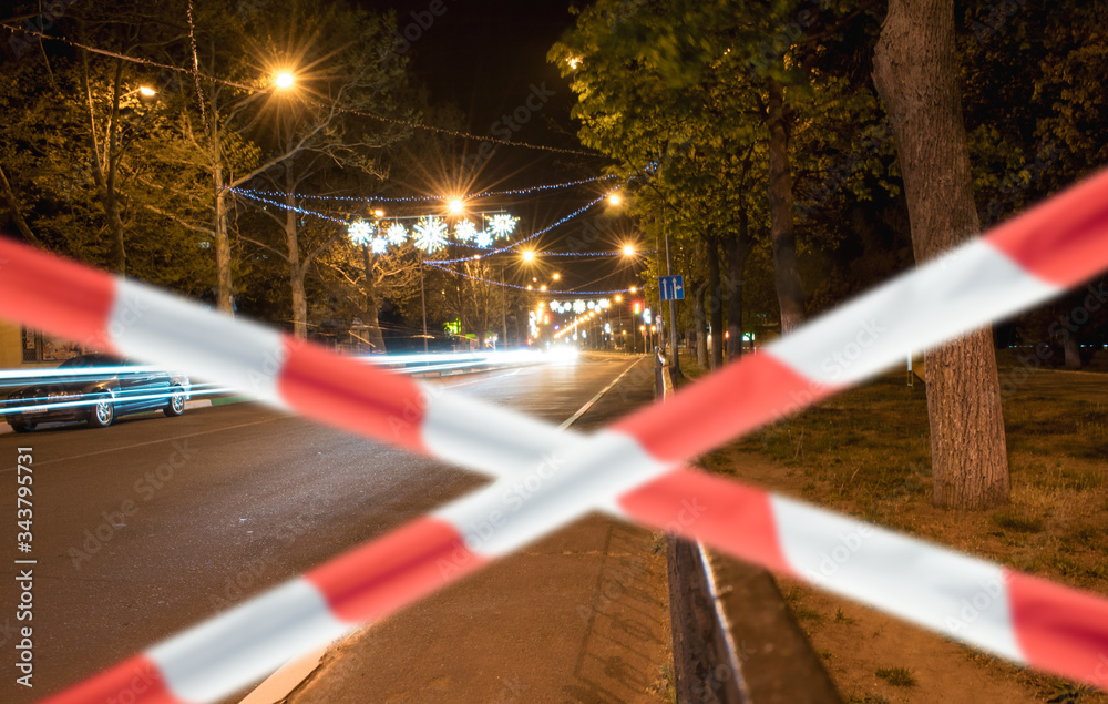 Barrier tape - quarantine, isolation, entry ban. Do not cross. Night ...