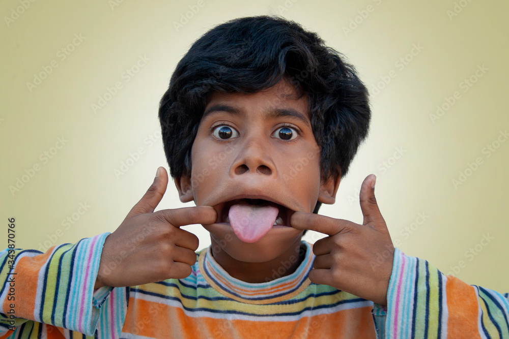 Boy Making Funny Faces Stock Photo | Adobe Stock