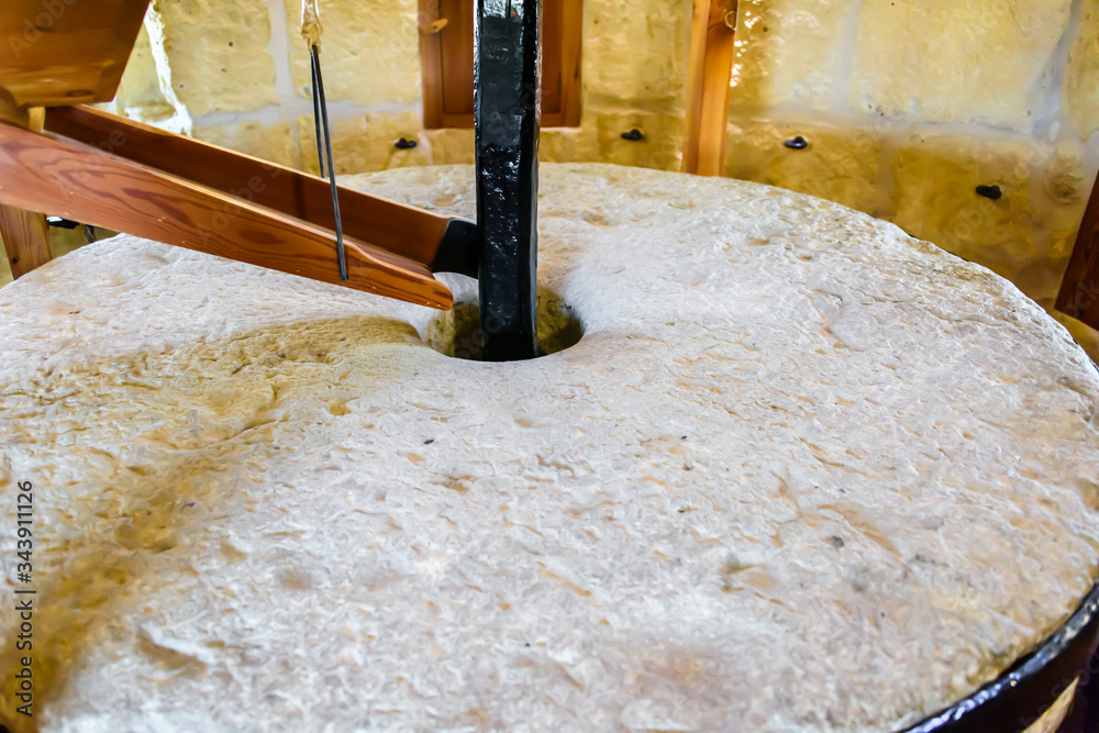 Chute for directing grain into the feed hole of a large grindstone ...