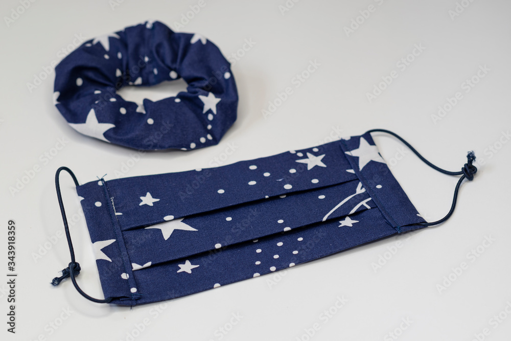 Selective focus on handmade cotton fabric face mask with matching ...