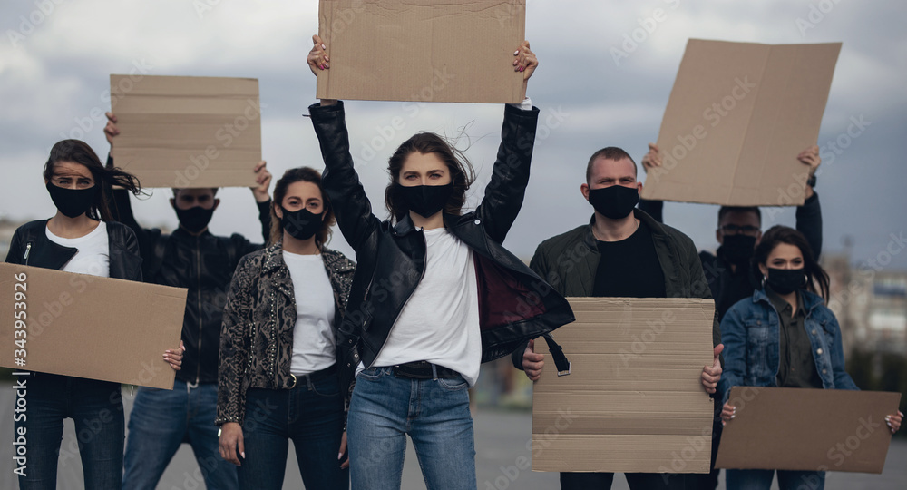Diverse group of people protesting with blank sign. Protest against ...