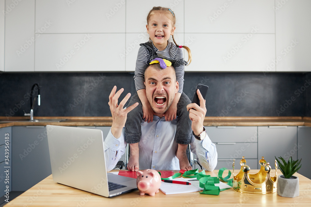 Angry Father Working from home on laptop during quarantine. Little ...