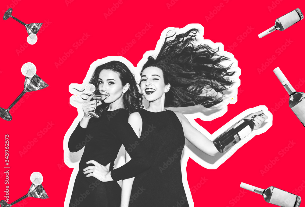 Two beautiful models of a girl in a black night dress hug, laugh and ...