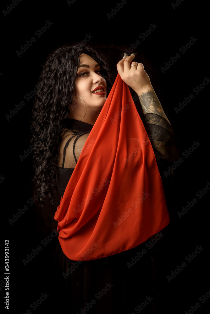 Girl gypsy fortune teller with a tattoo in a black dress with a red ...