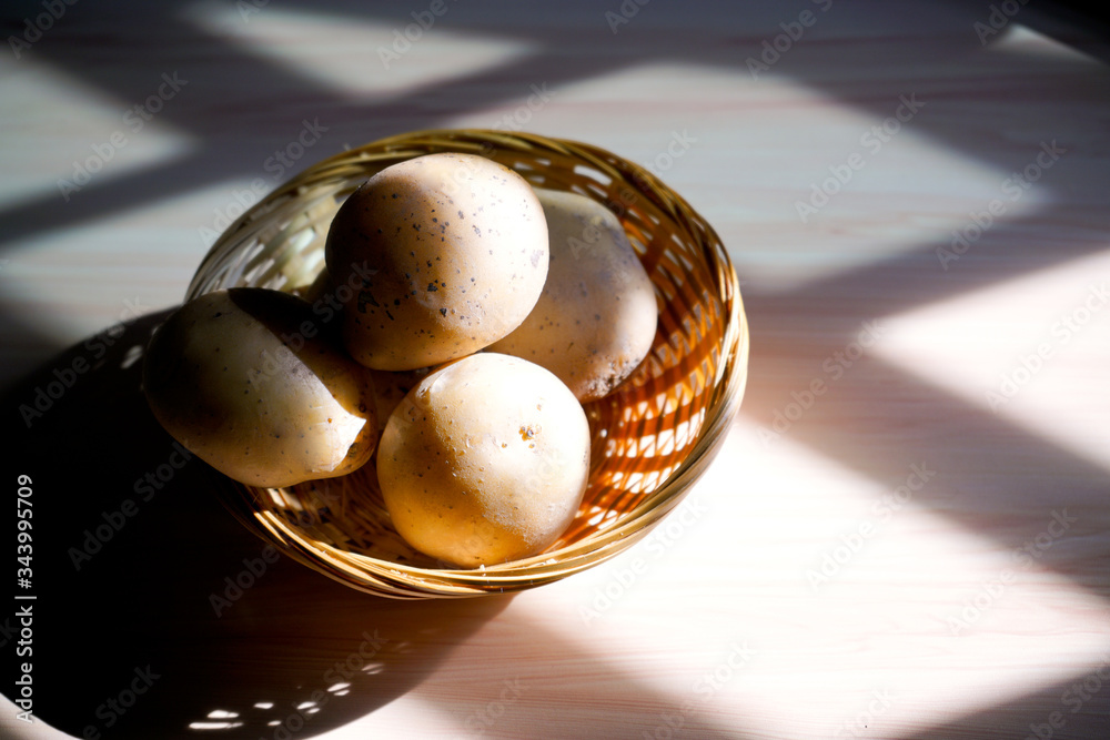 potatoes with lighting through windows in the wood background Stock ...