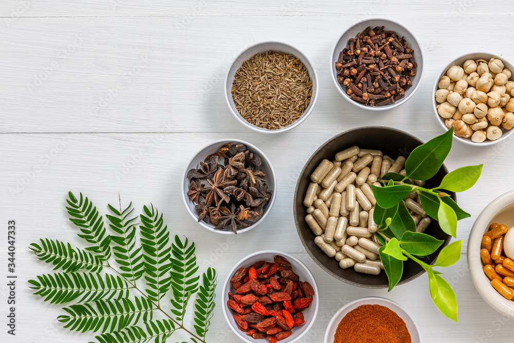 Herbal supplement in capsules with healthy medicinal plant.Alternative ...