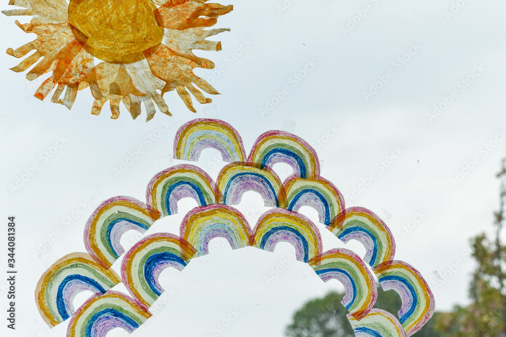 Kids drawings of rainbows in a window during covid-19 lockdown in uk ...