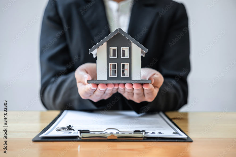 Real estate agent working sign agreement document contract for house ...