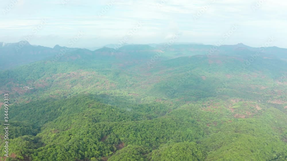Drone view of the western ghats covered in the forests and the folds in ...