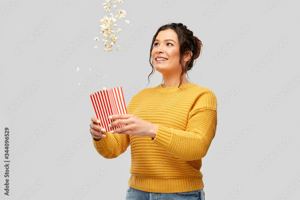 junk-food and people concept - happy smiling young woman with pierced ...