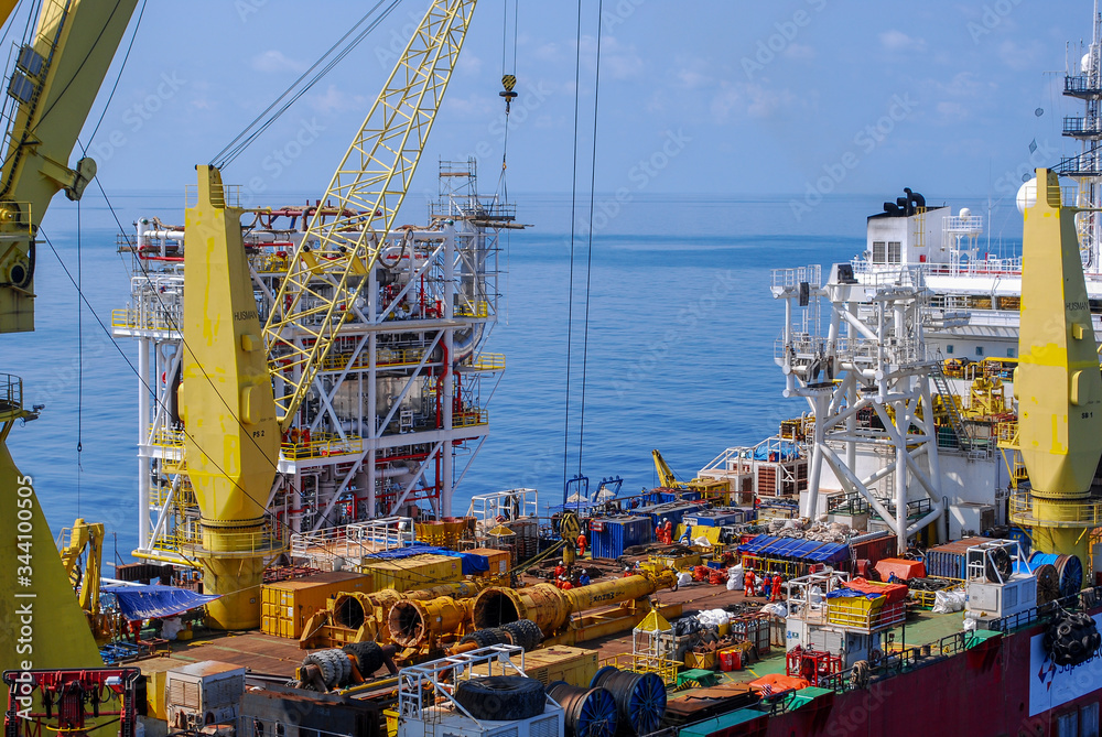 Large work barge carrying new structure module to be installed at oil ...