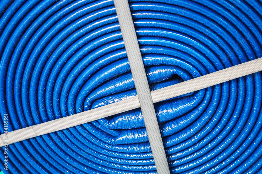 blue hose rolled up in a roll used for ventilation and air conditioning ...