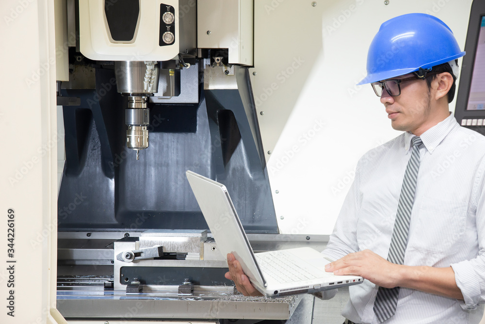 Engineer control use CAM software control the CNC milling machine with ...