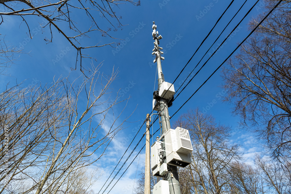 Telecommunication tower with microwave equipment, radio panel antennas ...