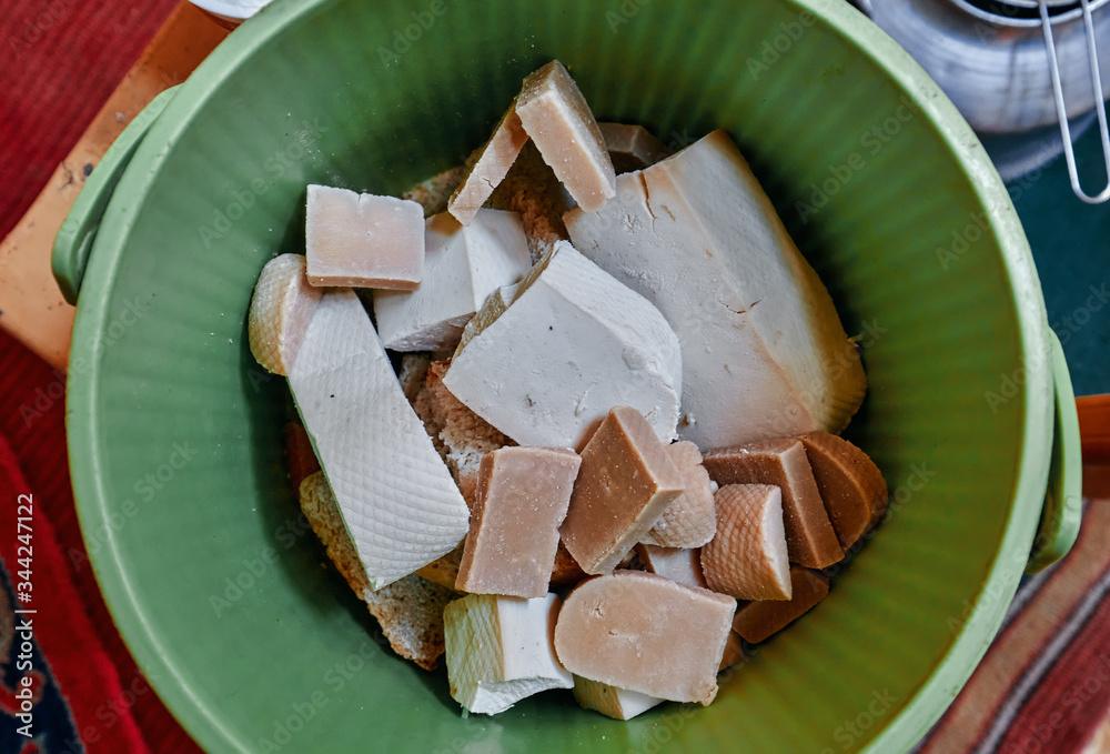 Goat cheese made by a Mongolian family in a Yurt. a traditional ...