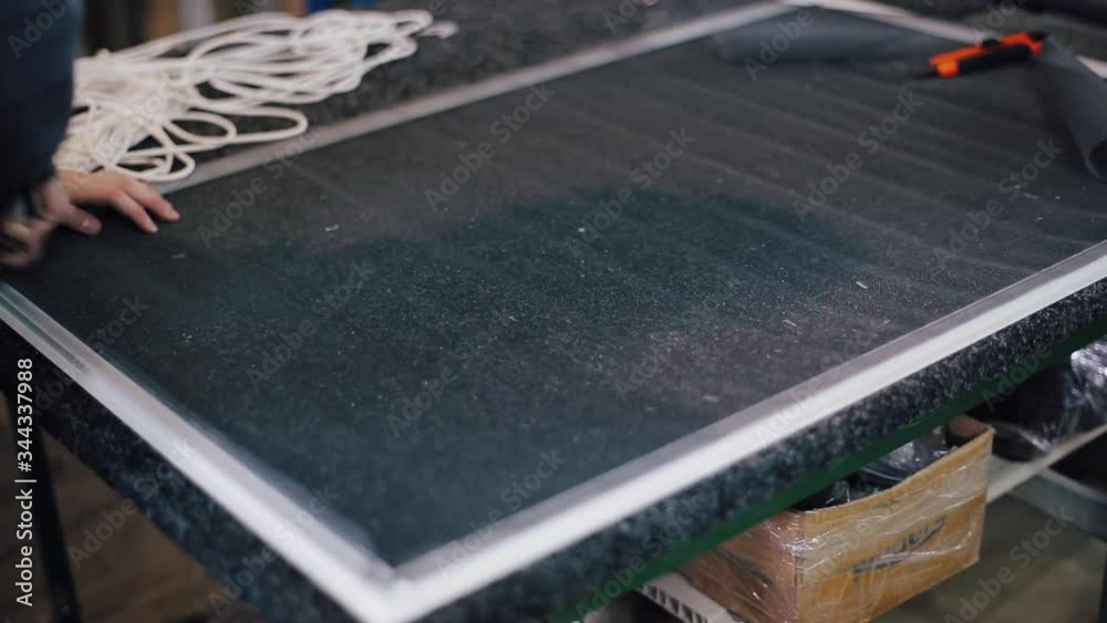 Worker makes a details for window, processing of makes a mosquito net ...