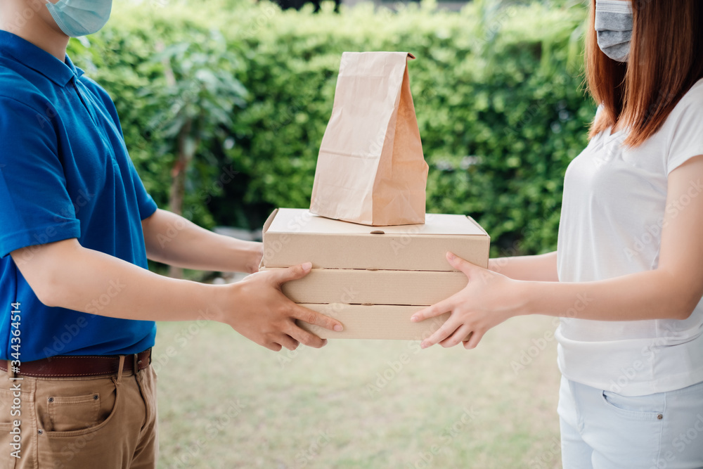 Delivery express of asian woman picking food social distancing wearing ...