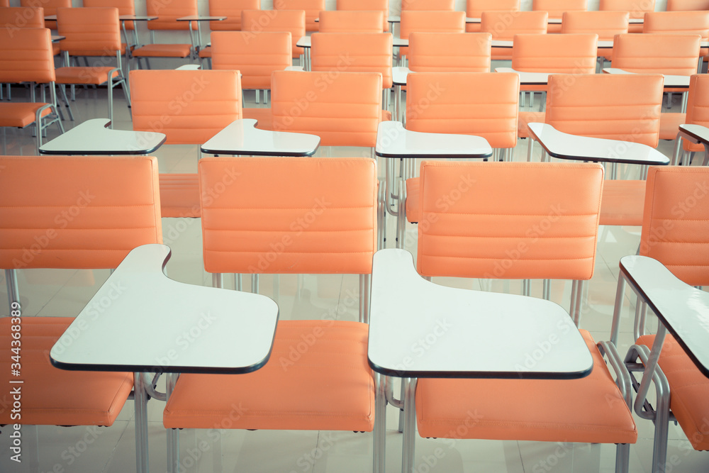 Vintage tone of Orange school chairs in empty classrooms Stock Photo ...