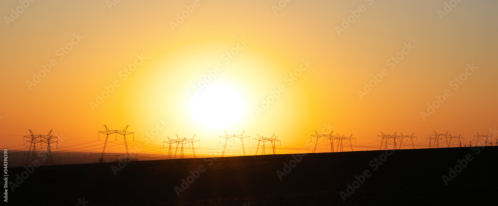 High voltage electric tower on sunset time panorama. sunset sky ...