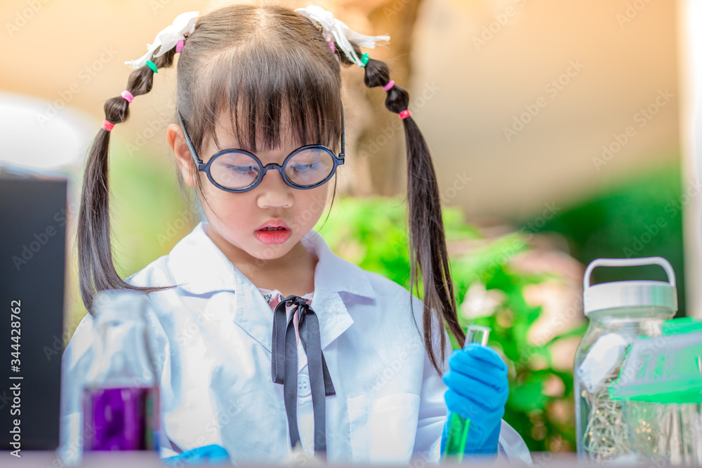 Close up view For a cute girl, a concept learning science process ...