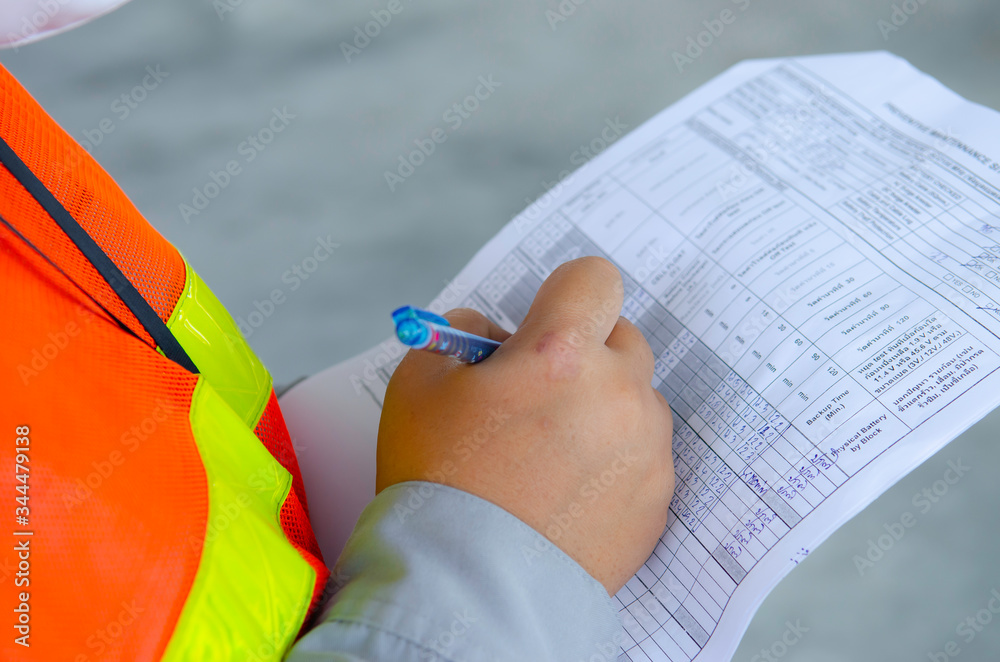 Engineer wear safety equipment write and record inspection report ...