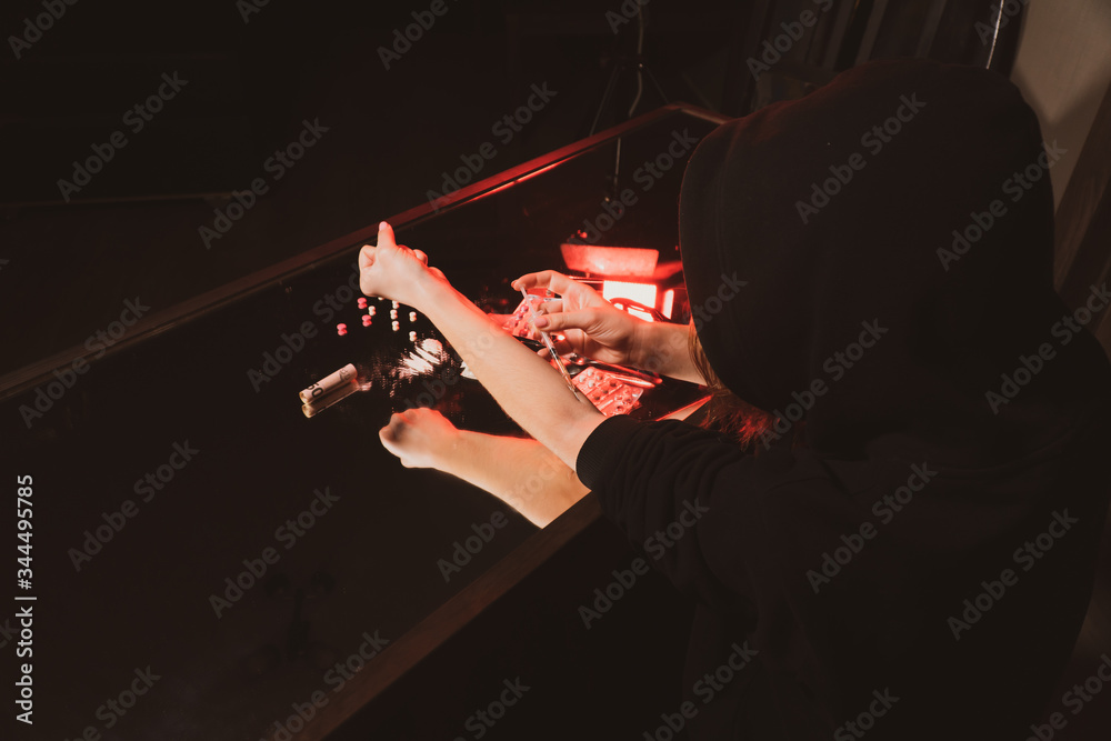 full background drug addict plans to inject heroin through a syringe ...