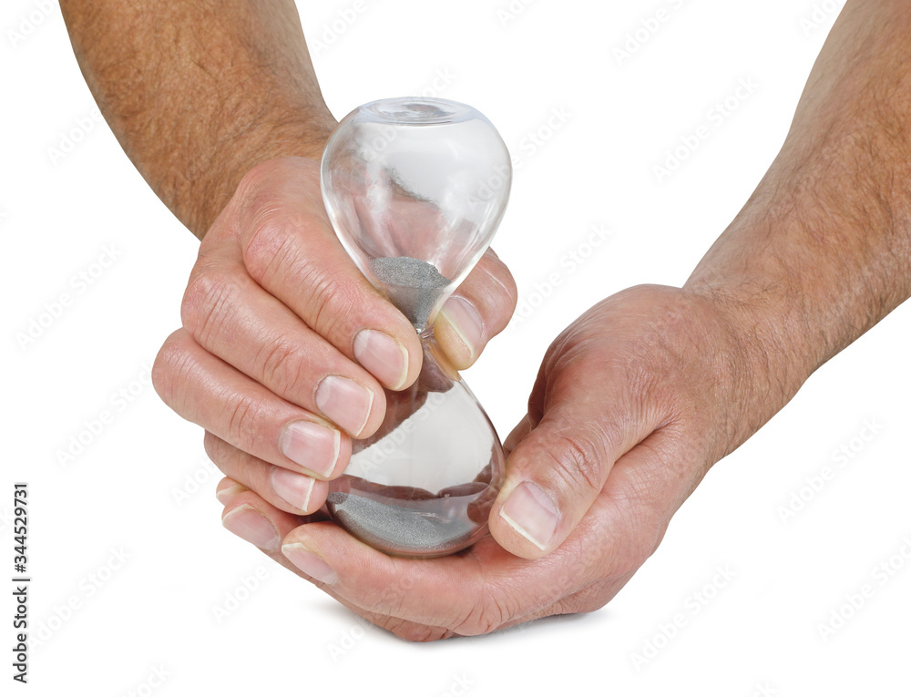 Time is running out literally - male hands holding a sand timer hour ...