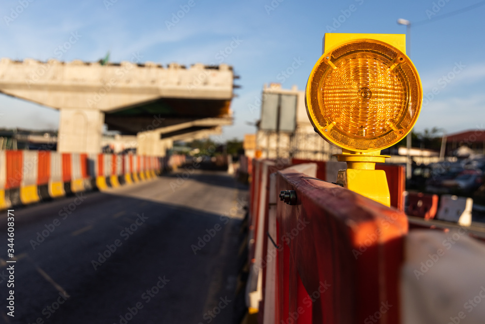 Hazard beacon light at highway construction site for traffic safety ...