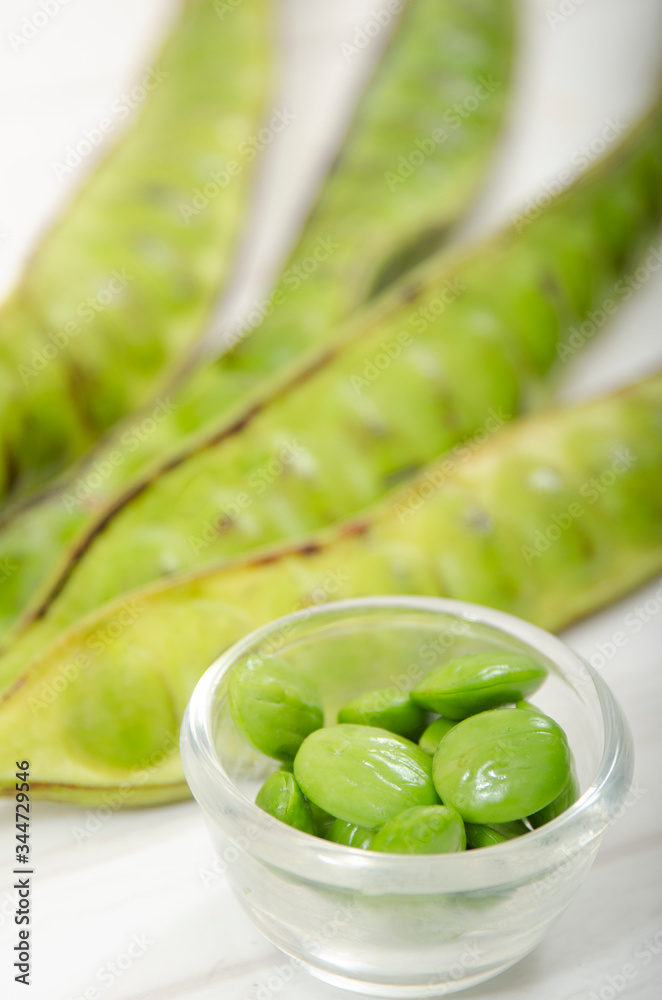 etai, pete or stinky bean, is asian vegetable. take photo in white ...