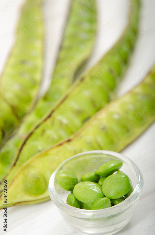 Petai, pete or stinky bean, is asian vegetable. take photo in white ...